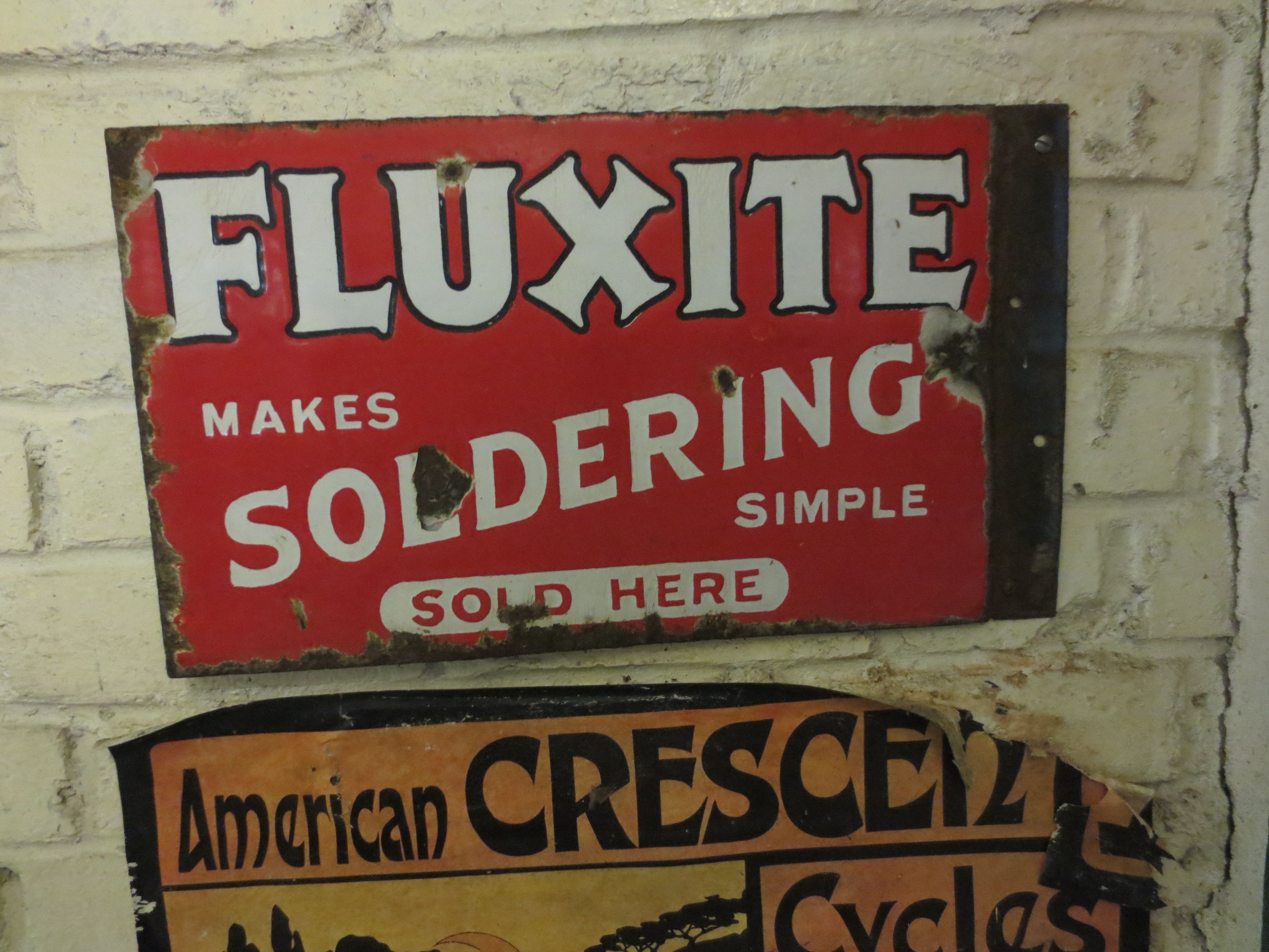 Bonhams Cars : A Fluxite 'Makes Soldering Simple' enamel sign,