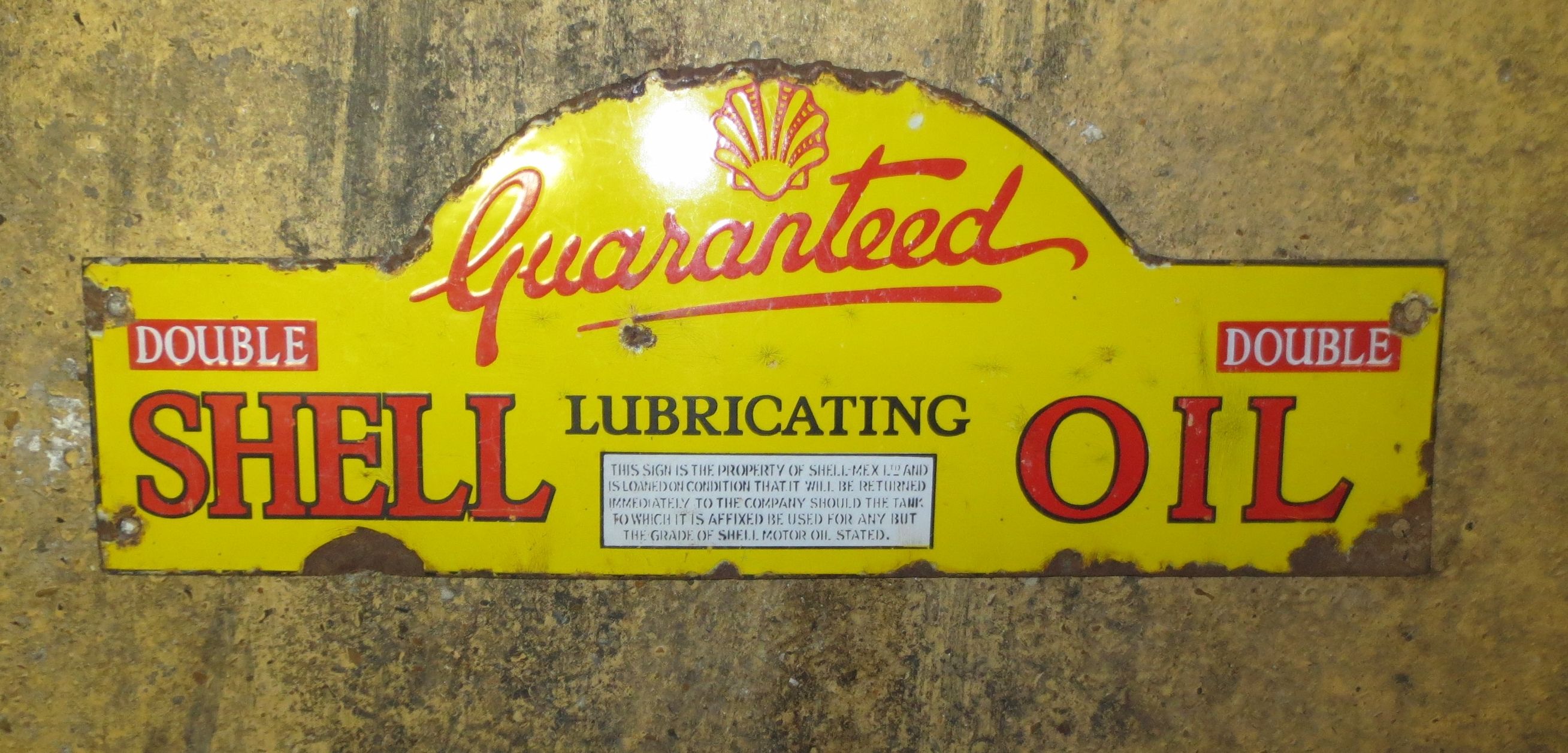 Bonhams Cars : A 'Guaranteed Double Shell Oil' enamel sign, circa 1925,