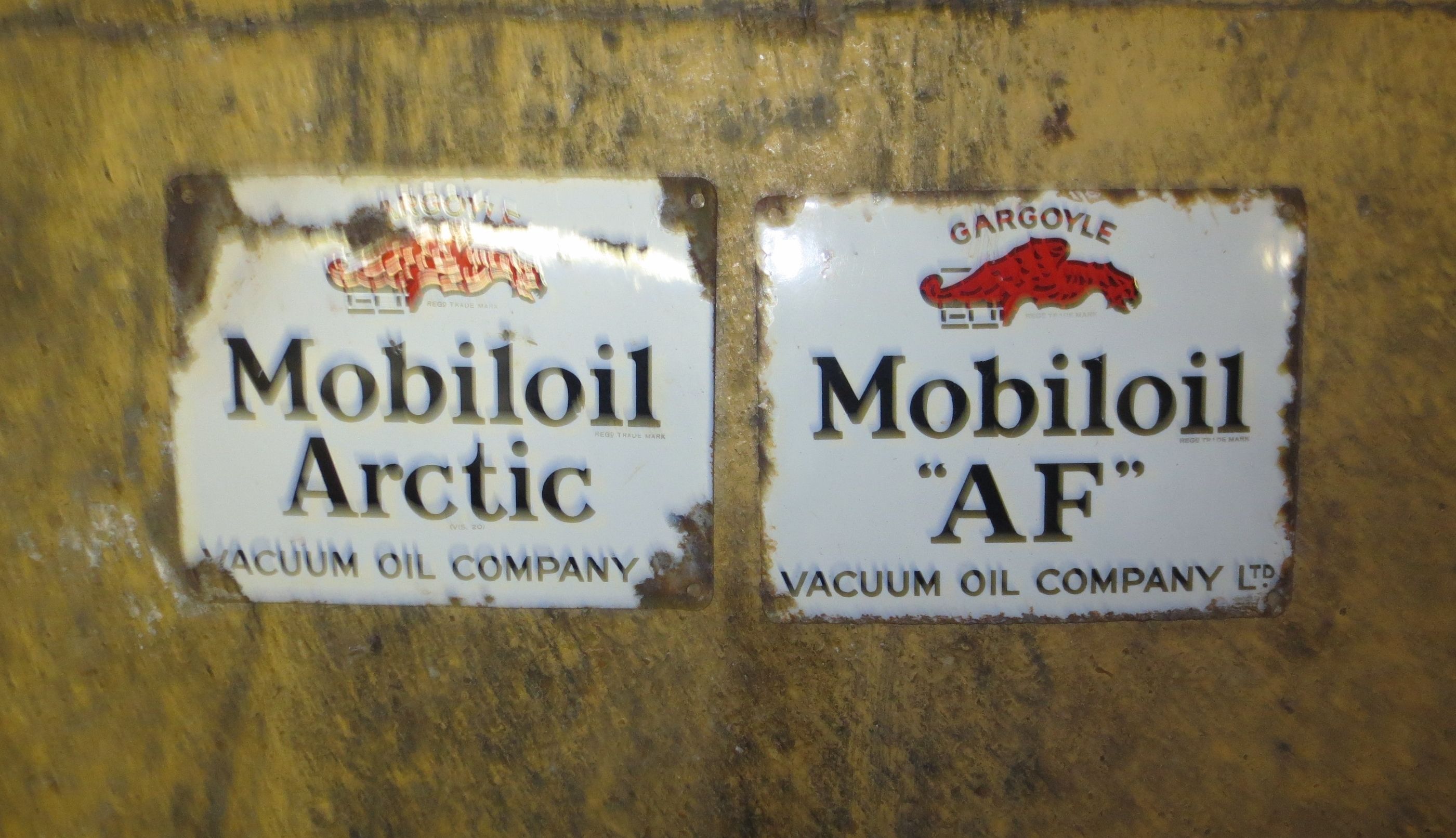 Bonhams Cars : Two Mobiloil enamel signs,