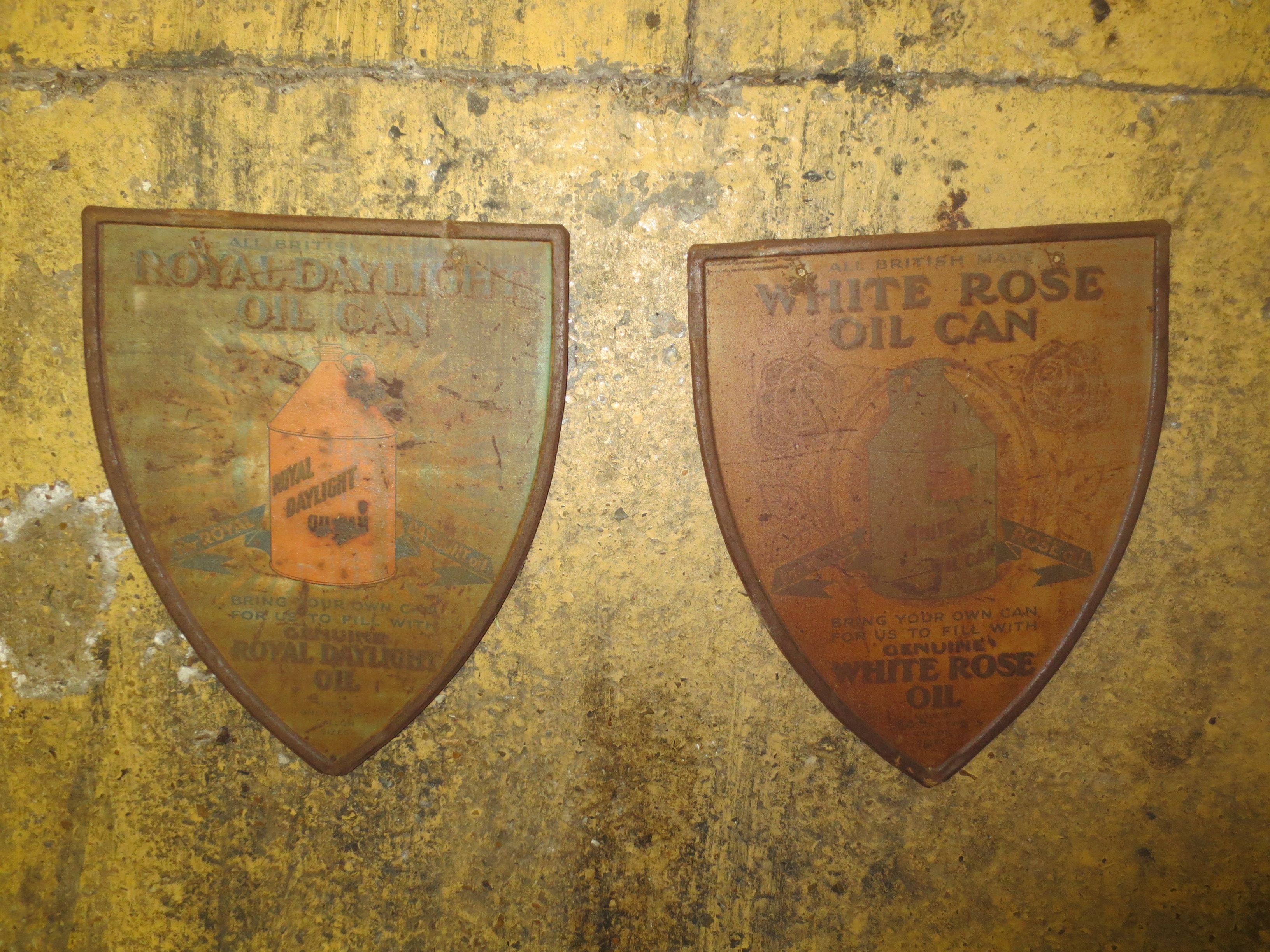 Bonhams Cars : Two early printed tin shield-shaped signs,
