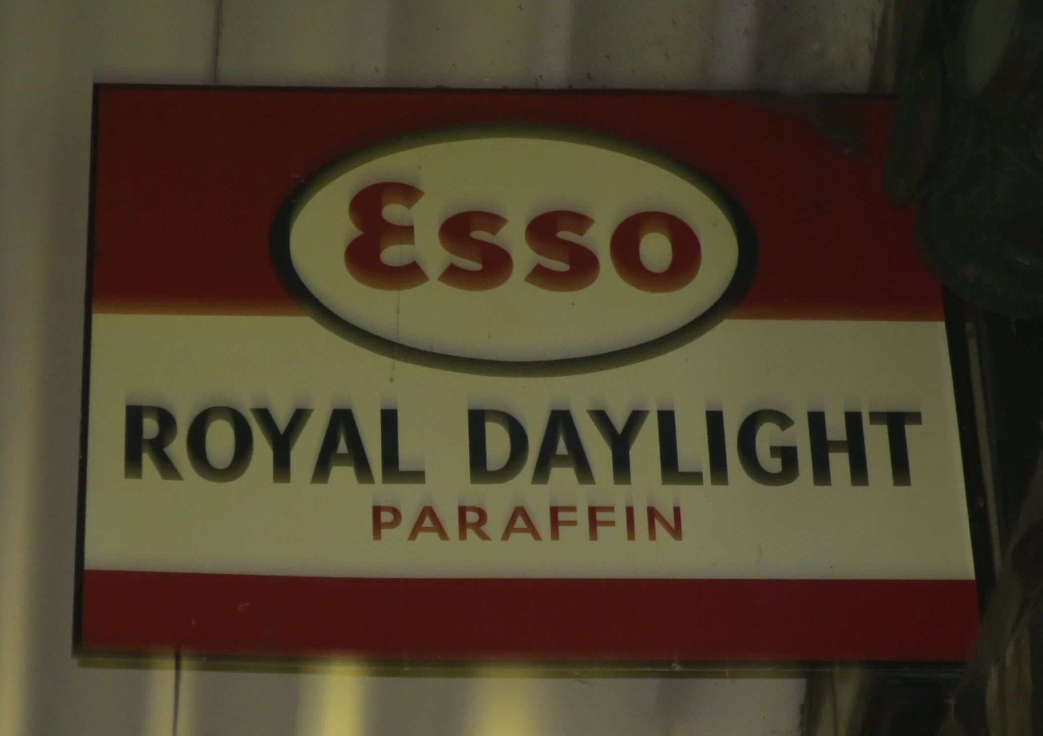 Bonhams Cars : An Esso Royal Daylight Paraffin printed tin sign,