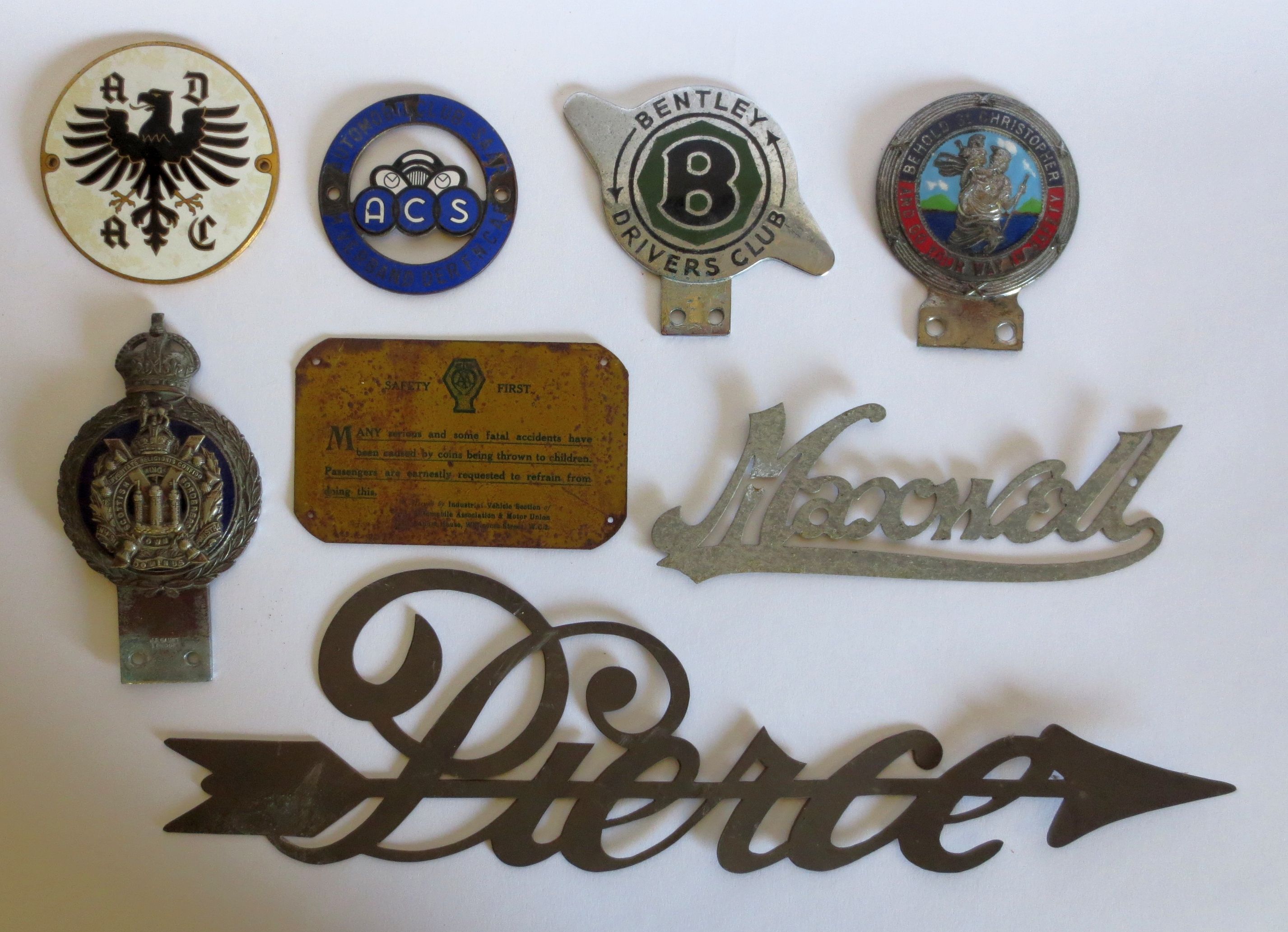 Bonhams Cars : Assorted badges, plaques and motoring scripts, enamel badges