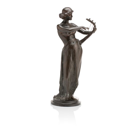 Bonhams : A bronze classical figure of a female harpist