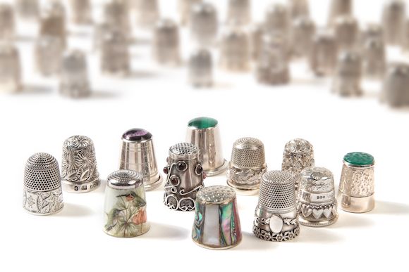 Bonhams : A group of sixty-four hallmarked and sterling silver thimbles