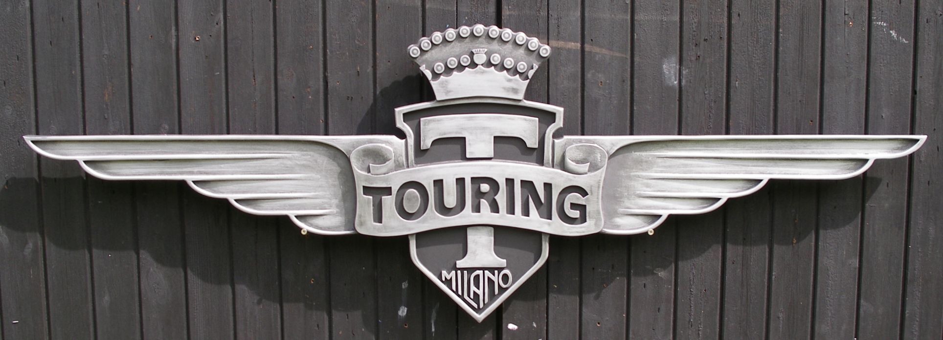 Bonhams Cars : A 'Carrozzeria Touring Milano' garage display emblem,