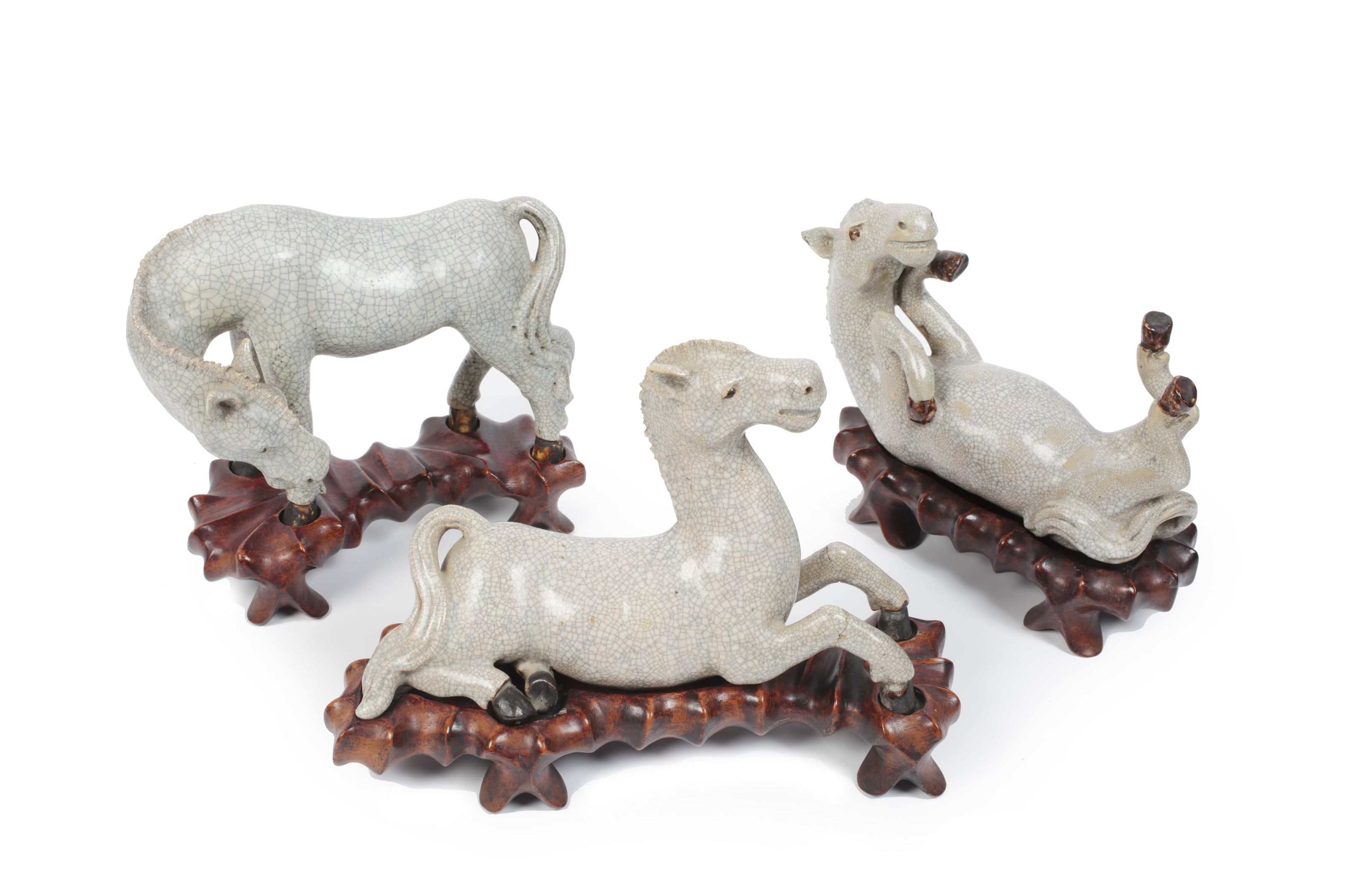 Bonhams : Three Chinese crackle glazed pottery models of horses
