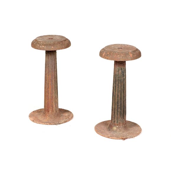Bonhams : A pair of cast iron haystack stands