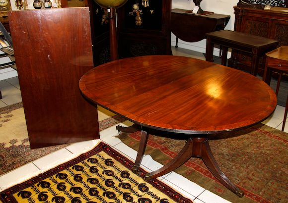 Bonhams : A twin pillar mahogany double 'D' end dining table, the burr ...