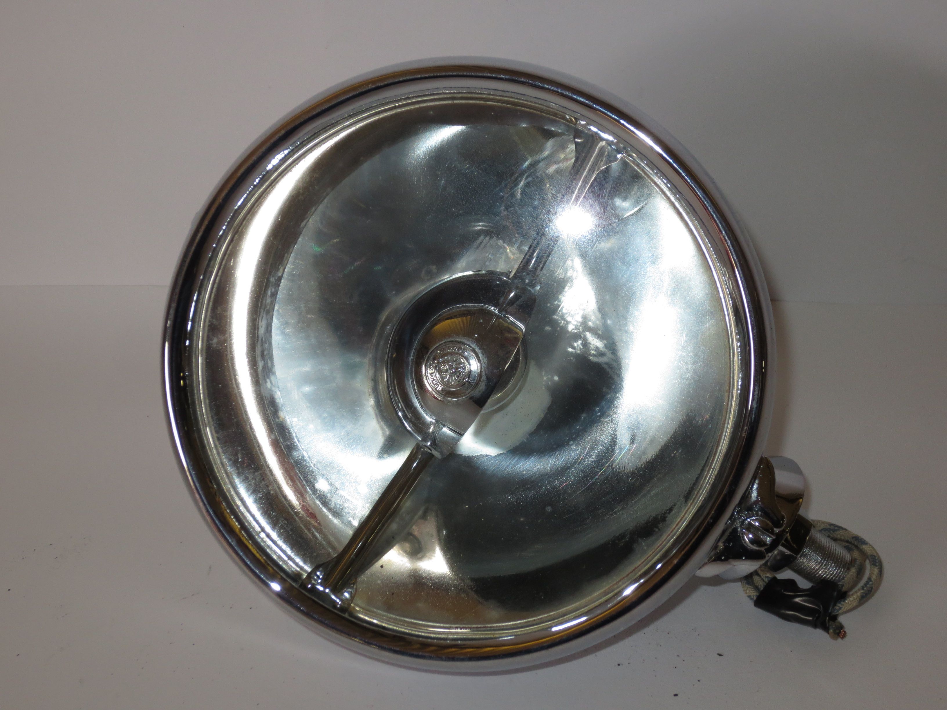 Bonhams Cars : A Lucas split-reflector driving light,