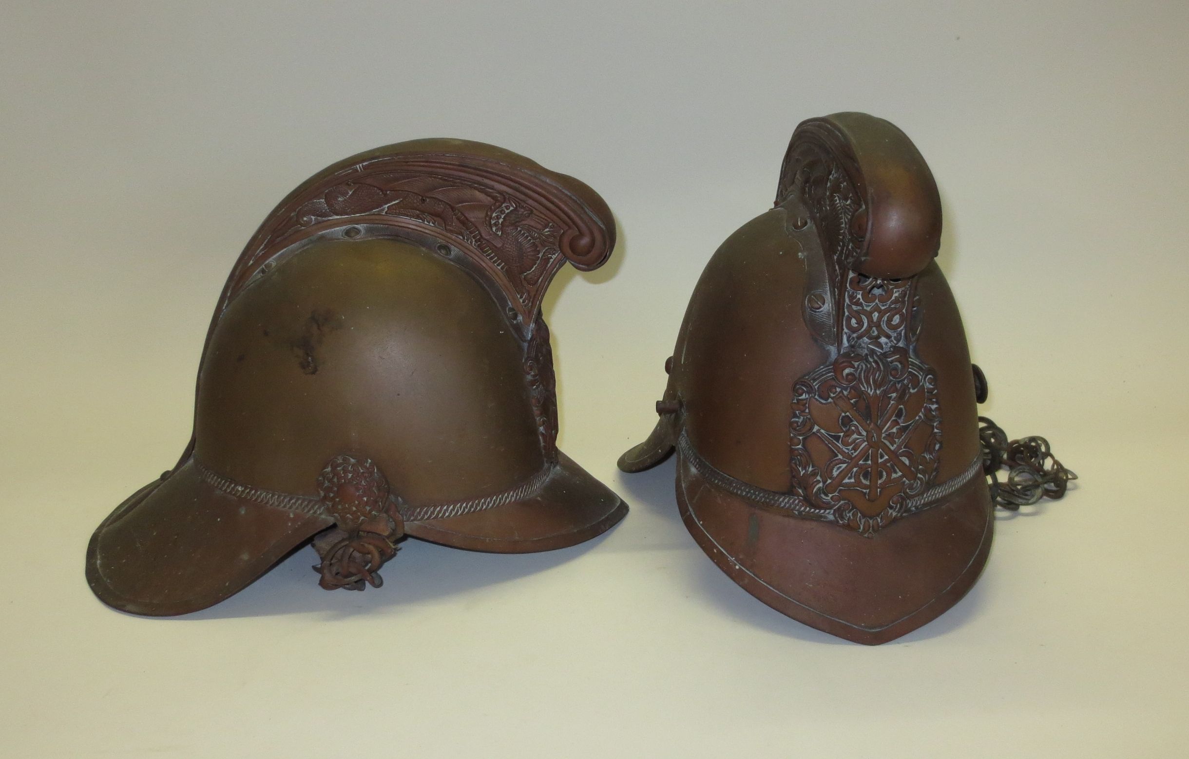 Bonhams Cars : Two traditional brass fireman's helmets,