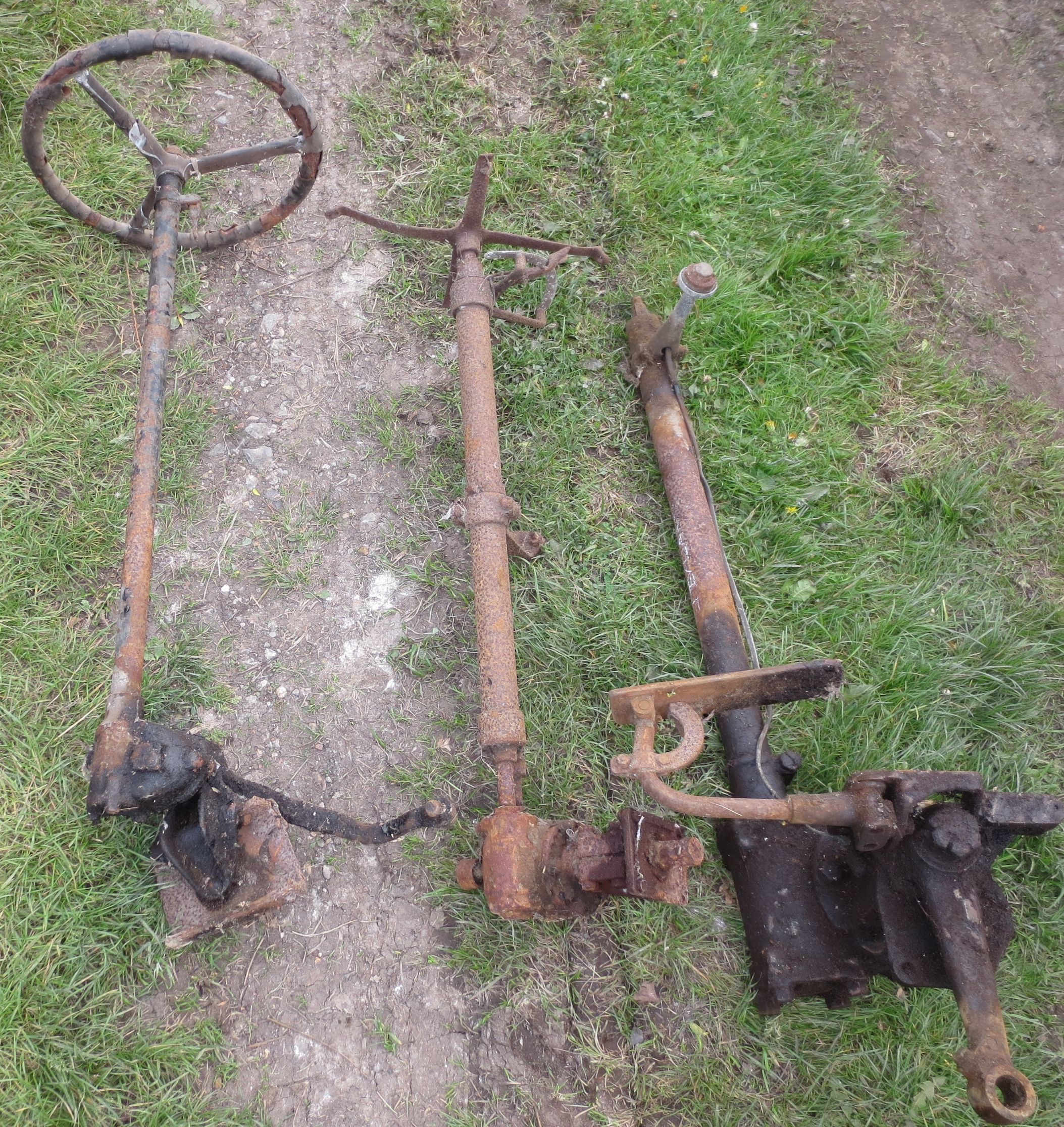 Bonhams Cars : Three steering boxes with columns,