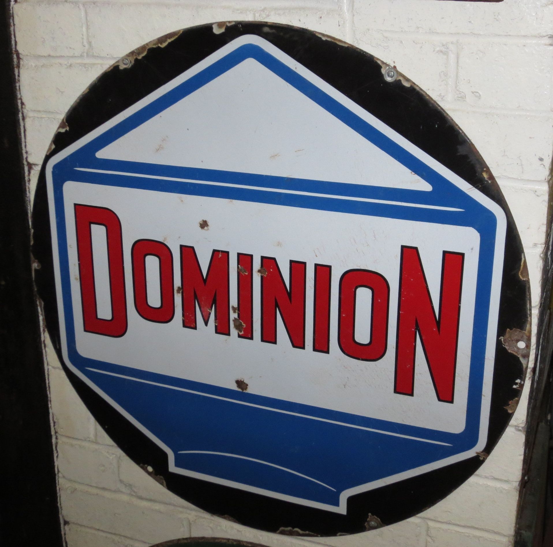 Bonhams Cars : A Dominion enamel sign,