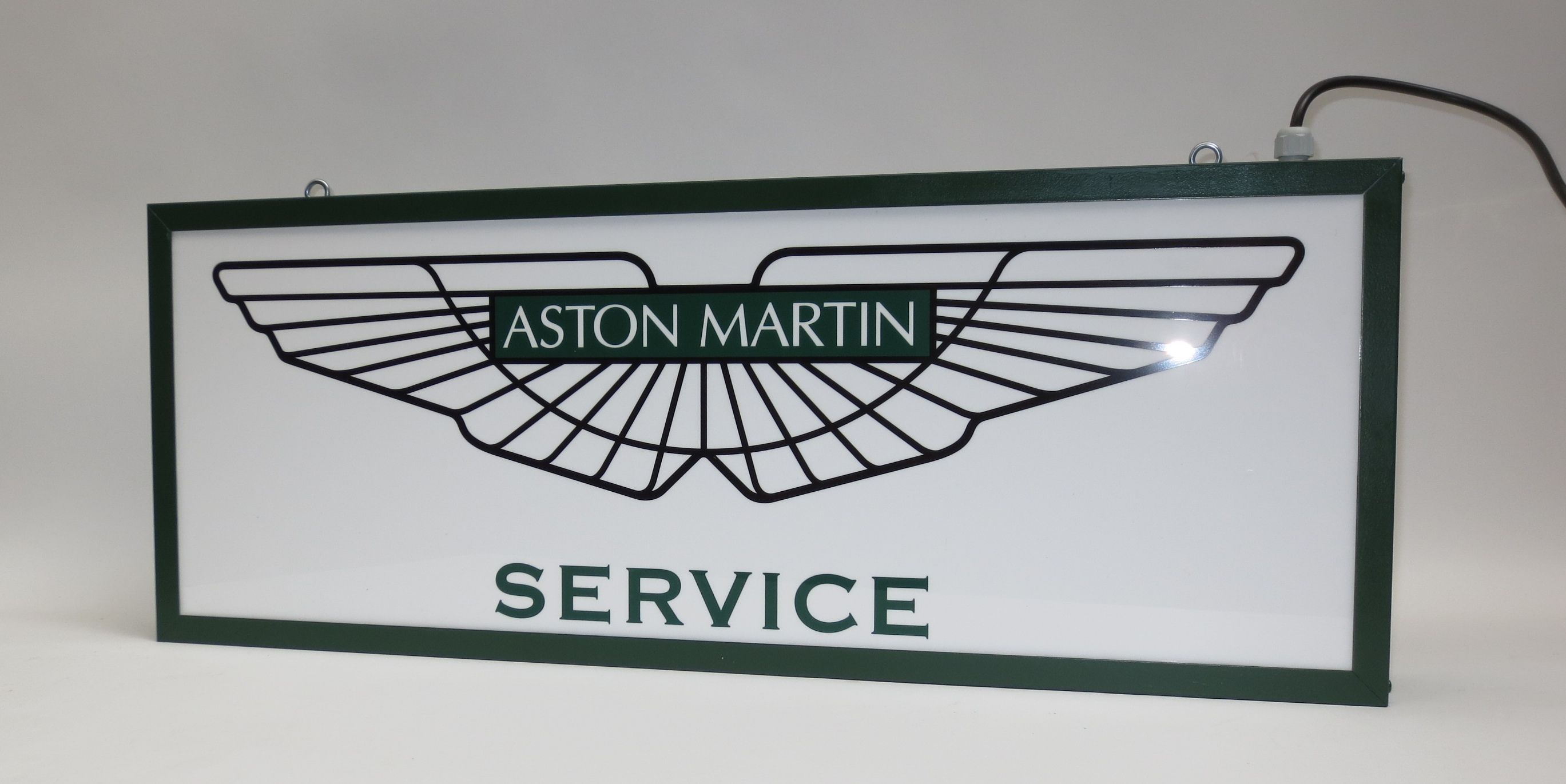 Bonhams Cars : An 'Aston Martin Service' illuminated sign,