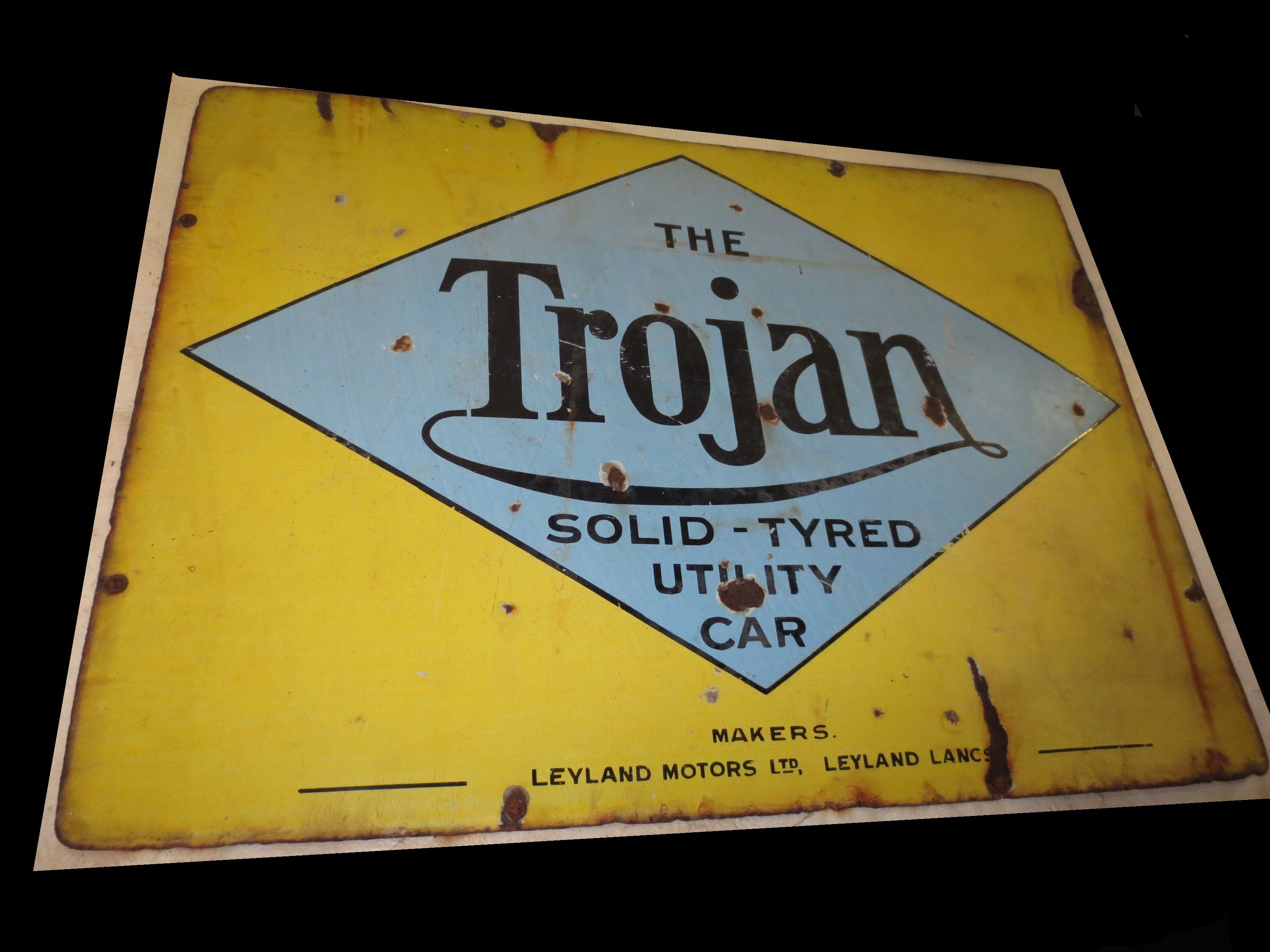 Bonhams Cars : A Trojan enamel sign,