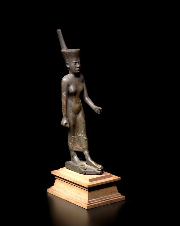 Bonhams : An Egyptian bronze figure of Neith
