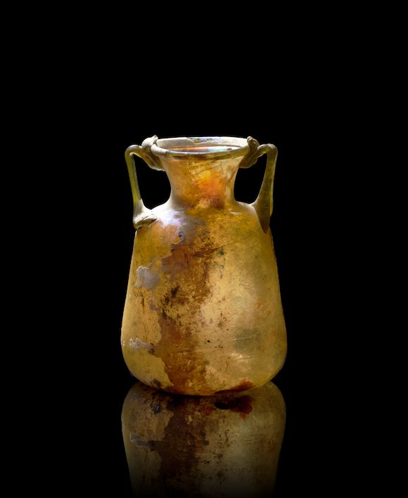 Bonhams : A large Roman amber glass amphora