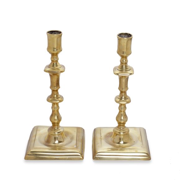 Bonhams : A pair of mid-18th century brass square-based candlesticks ...