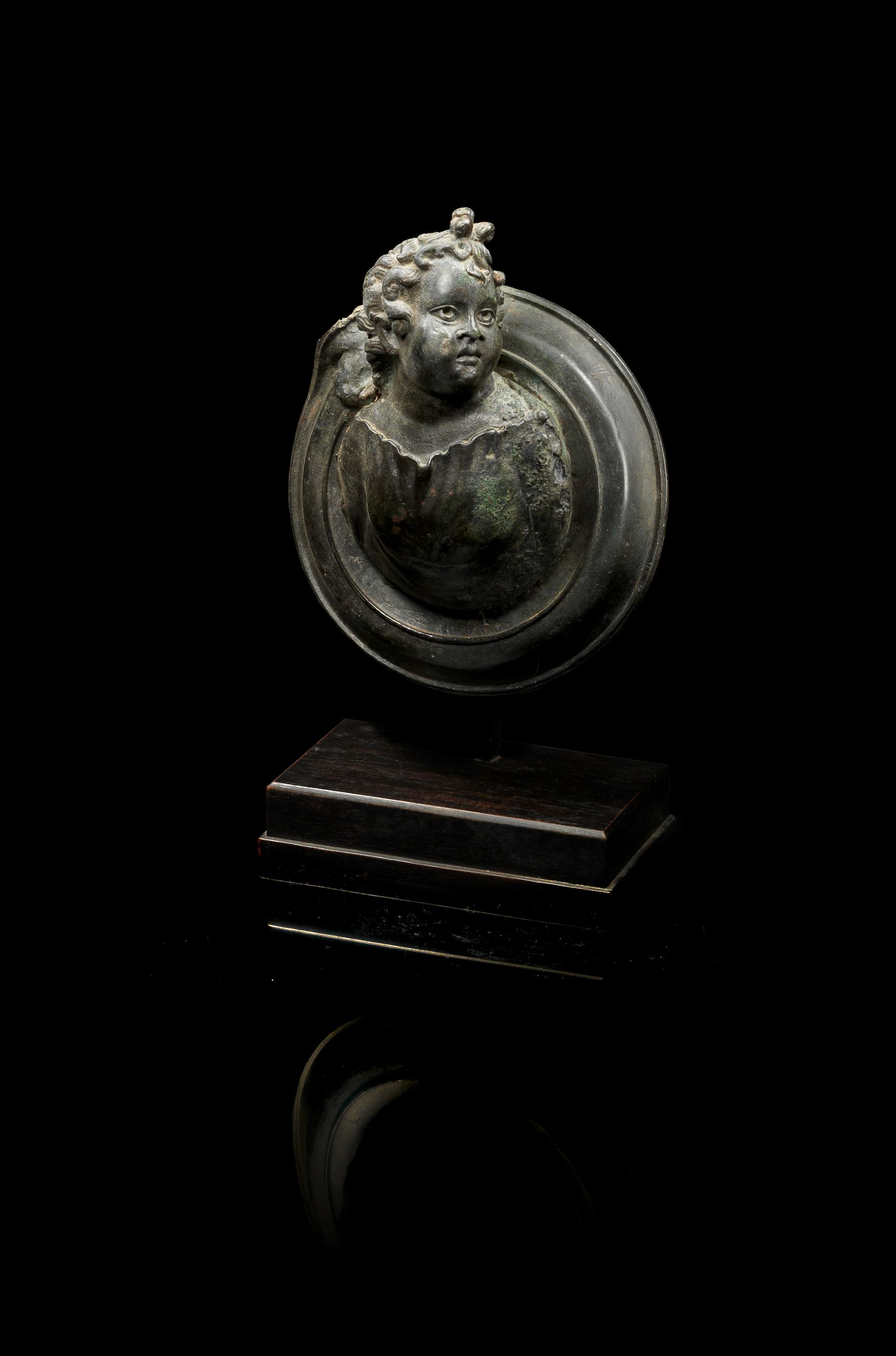Bonhams : A Roman bronze roundel of Eros