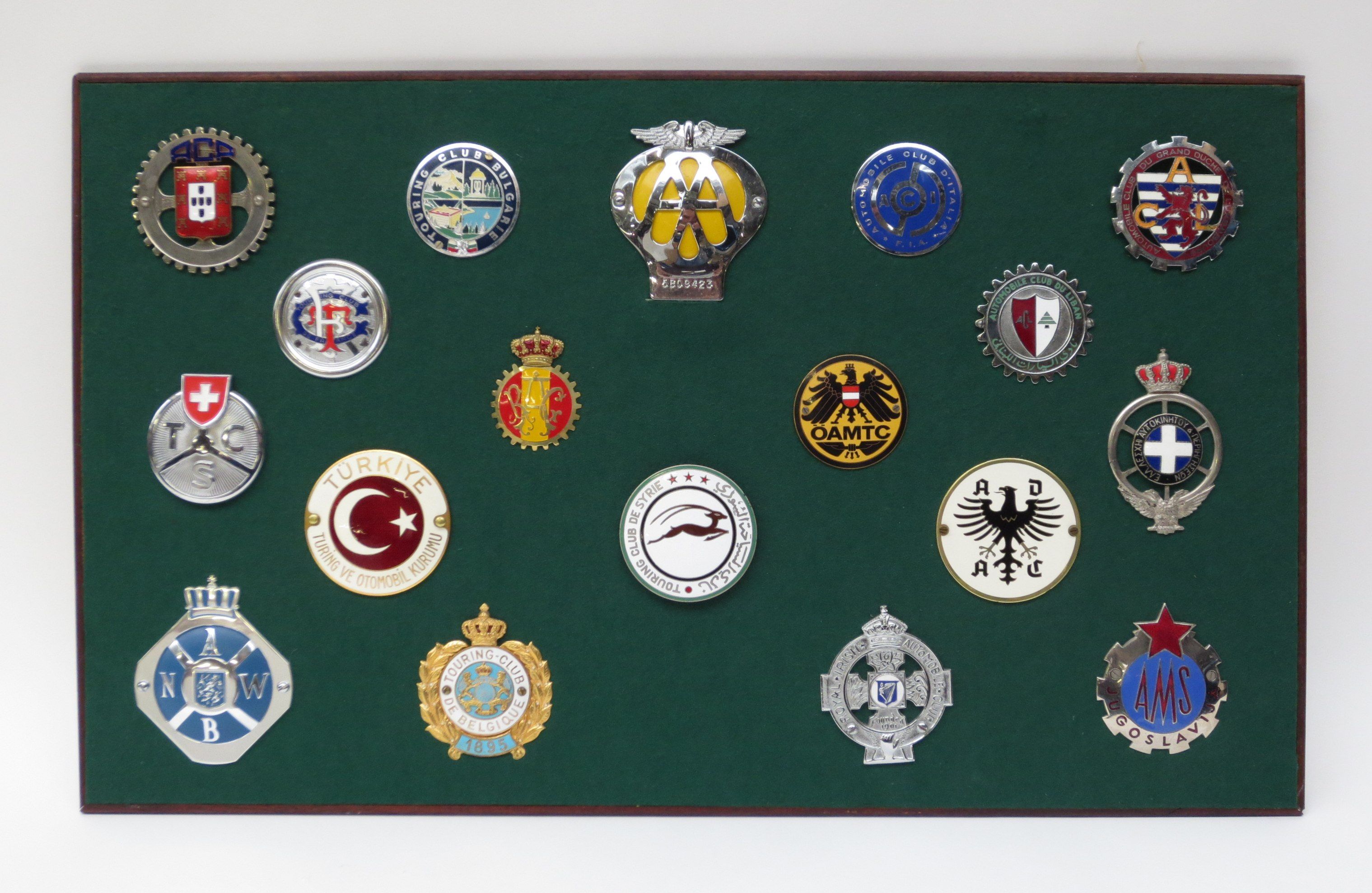 Bonhams Cars : A display of eighteen car badges,