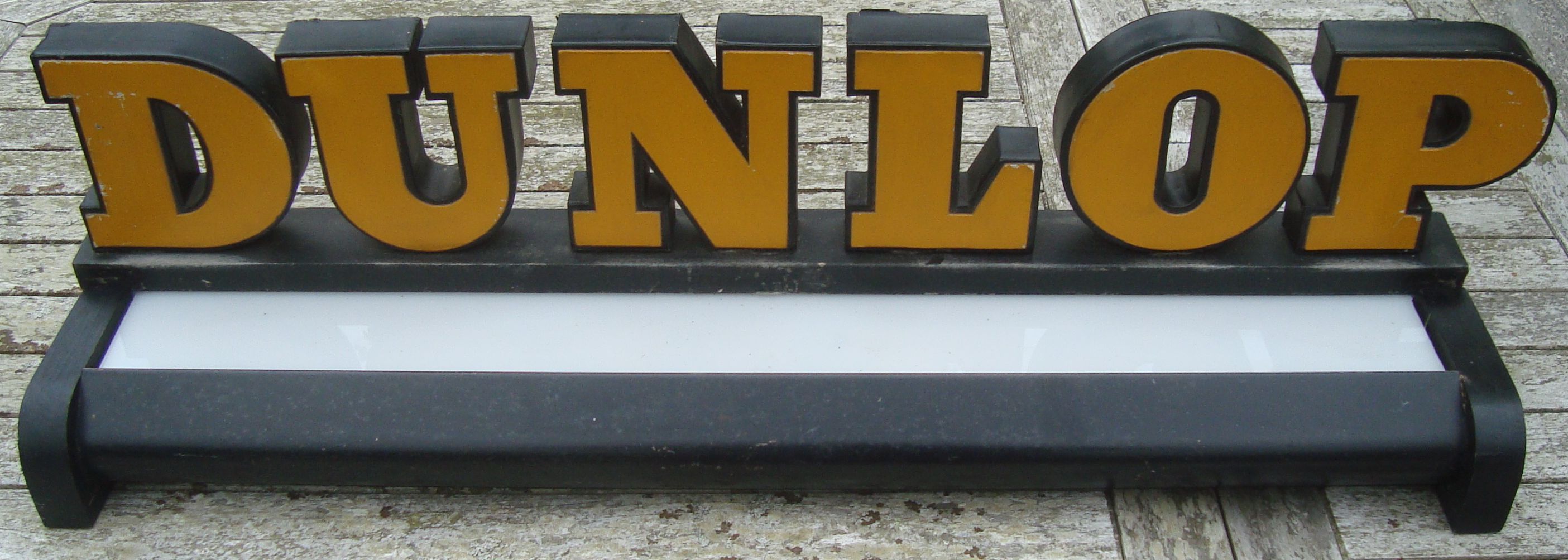 Bonhams Cars : A Dunlop shop counter advertising sign by Fritz Dienes ...