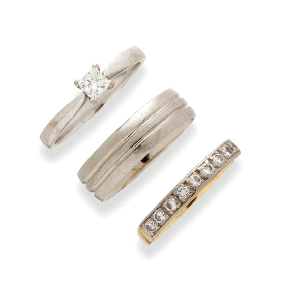 Bonhams : A diamond single stone ring, a diamond half hoop ring and a ...