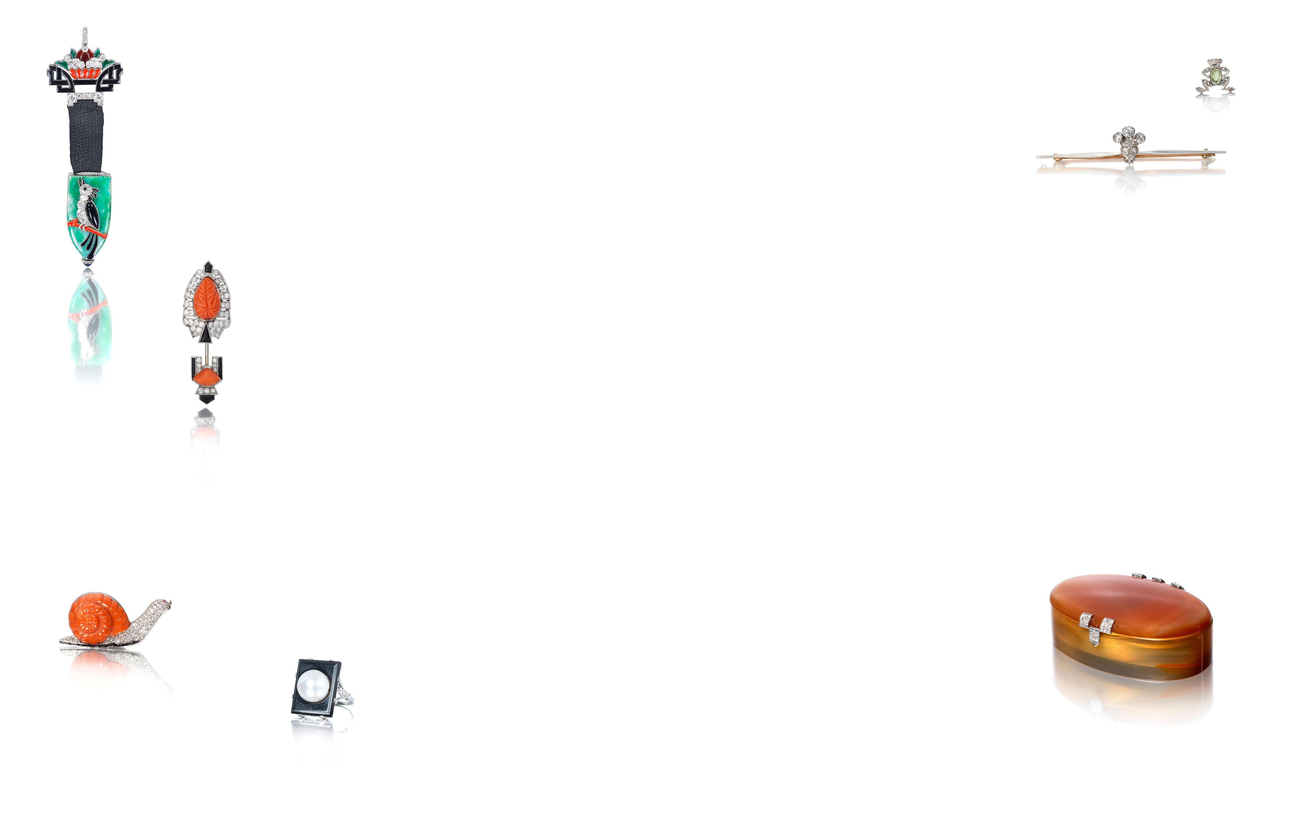 Bonhams : An art deco coral, diamond and onyx cliquet pin,