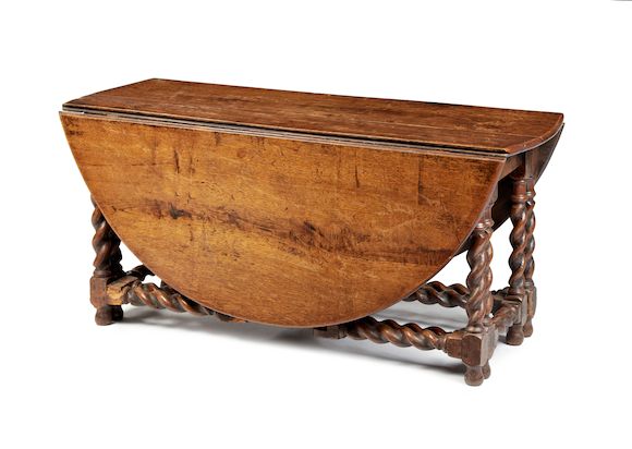Bonhams : A large oak double gate-leg dining table The base largely ...