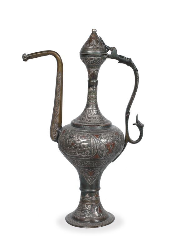 Bonhams : A Syrian metal ware lidded ewer