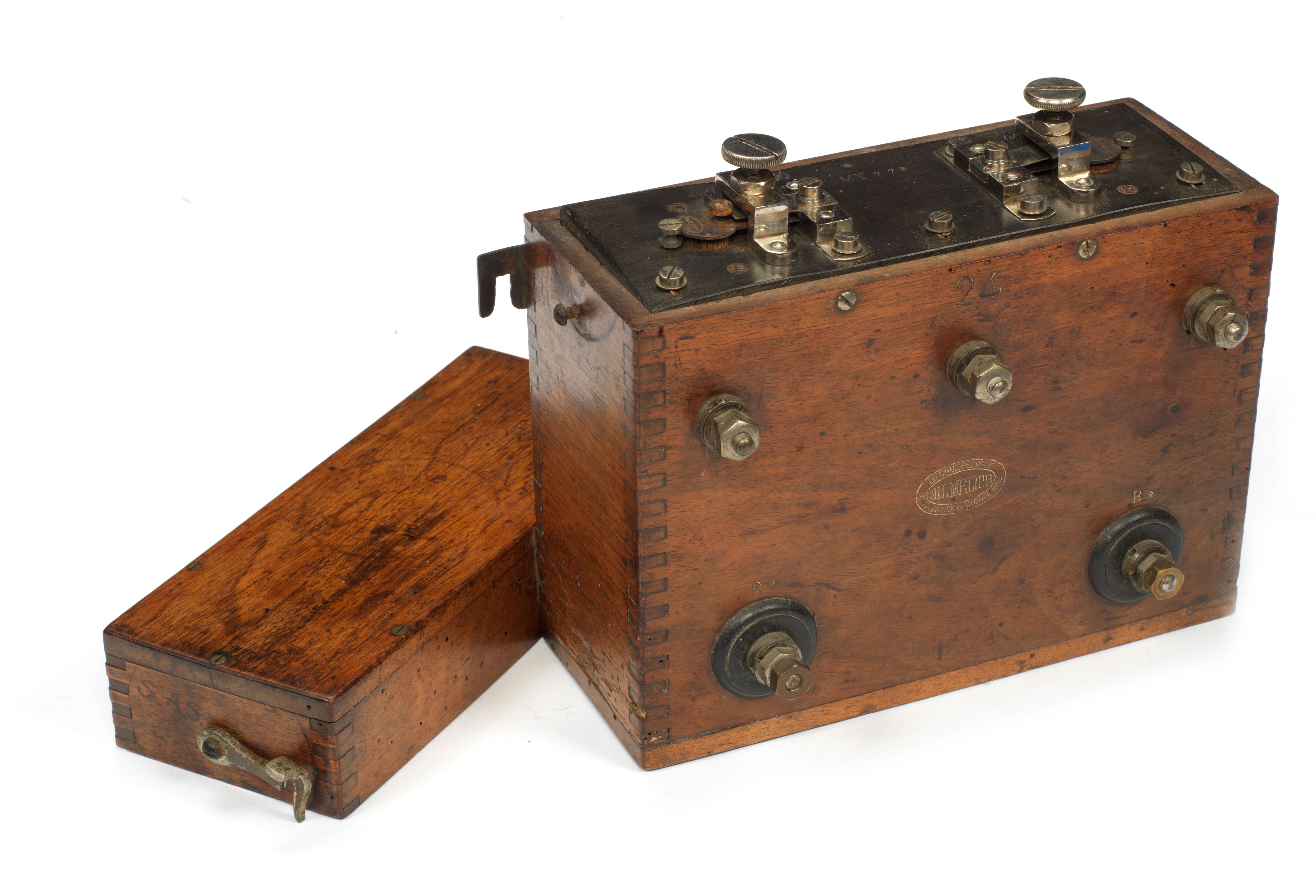 Bonhams Cars : A Nilmelior dual trembler coil with lid by Bassee ...