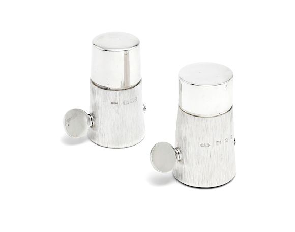 Bonhams : GERALD BENNEY: Two silver pepper mills London 1975 and 1979 (2)