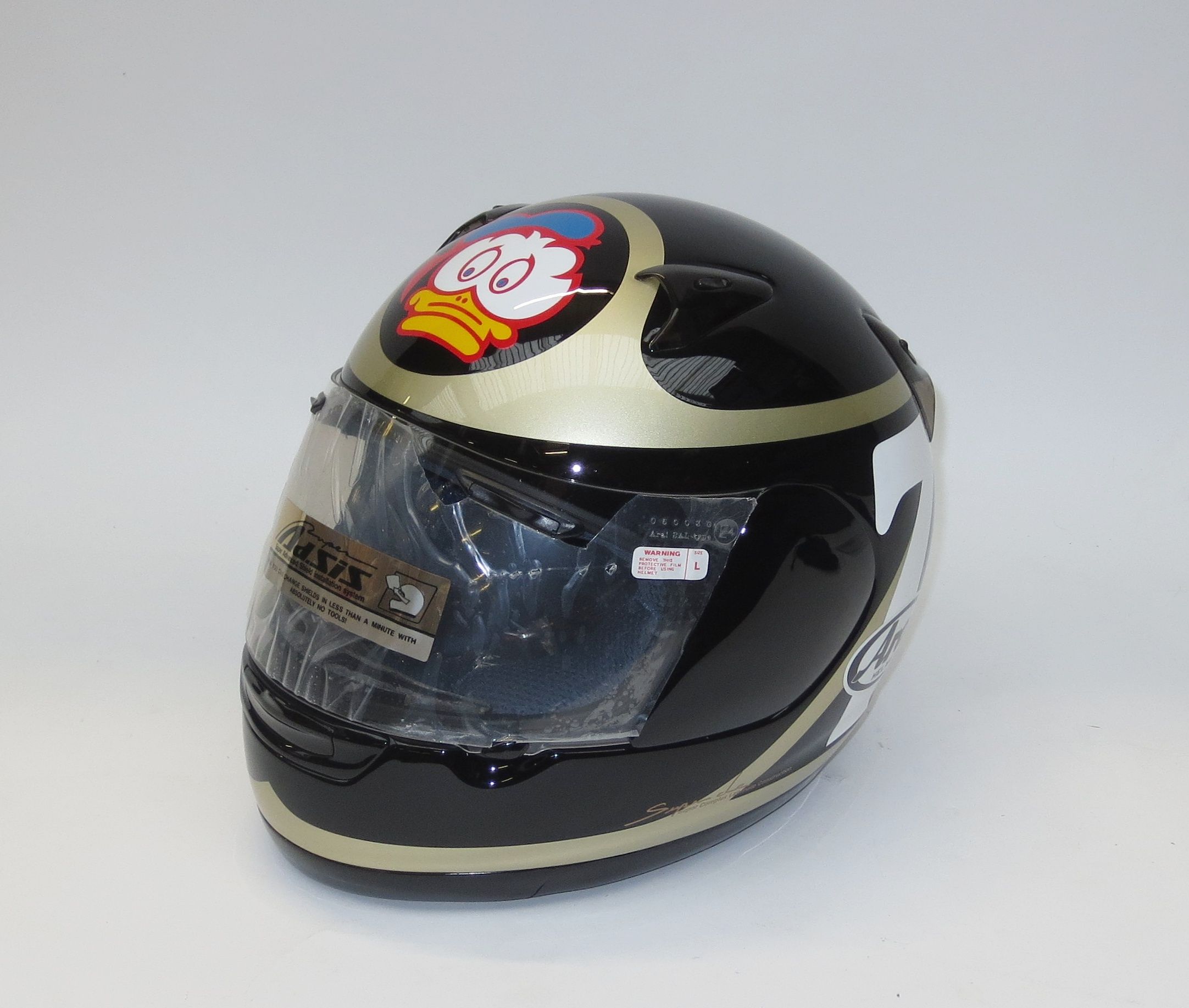 Bonhams Cars : A Barry Sheene limited edition replica helmet, by Arai,