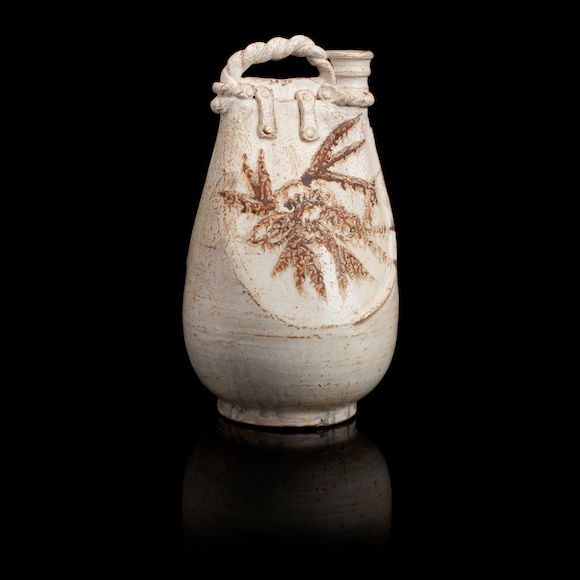 Bonhams : A rare buff-glazed pottery flask Liao