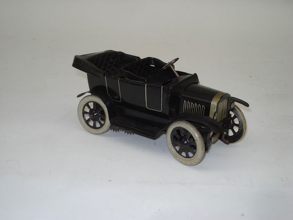 Bonhams : Tinplate c/w open top Model T Ford, probably Bing German 1920s