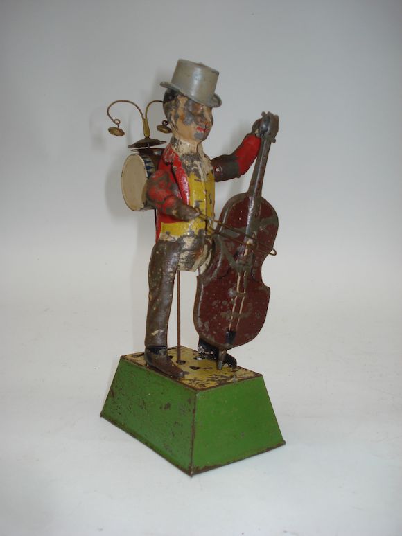 Bonhams : Tinplate c/w hand painted Street Busker, German circa 1905