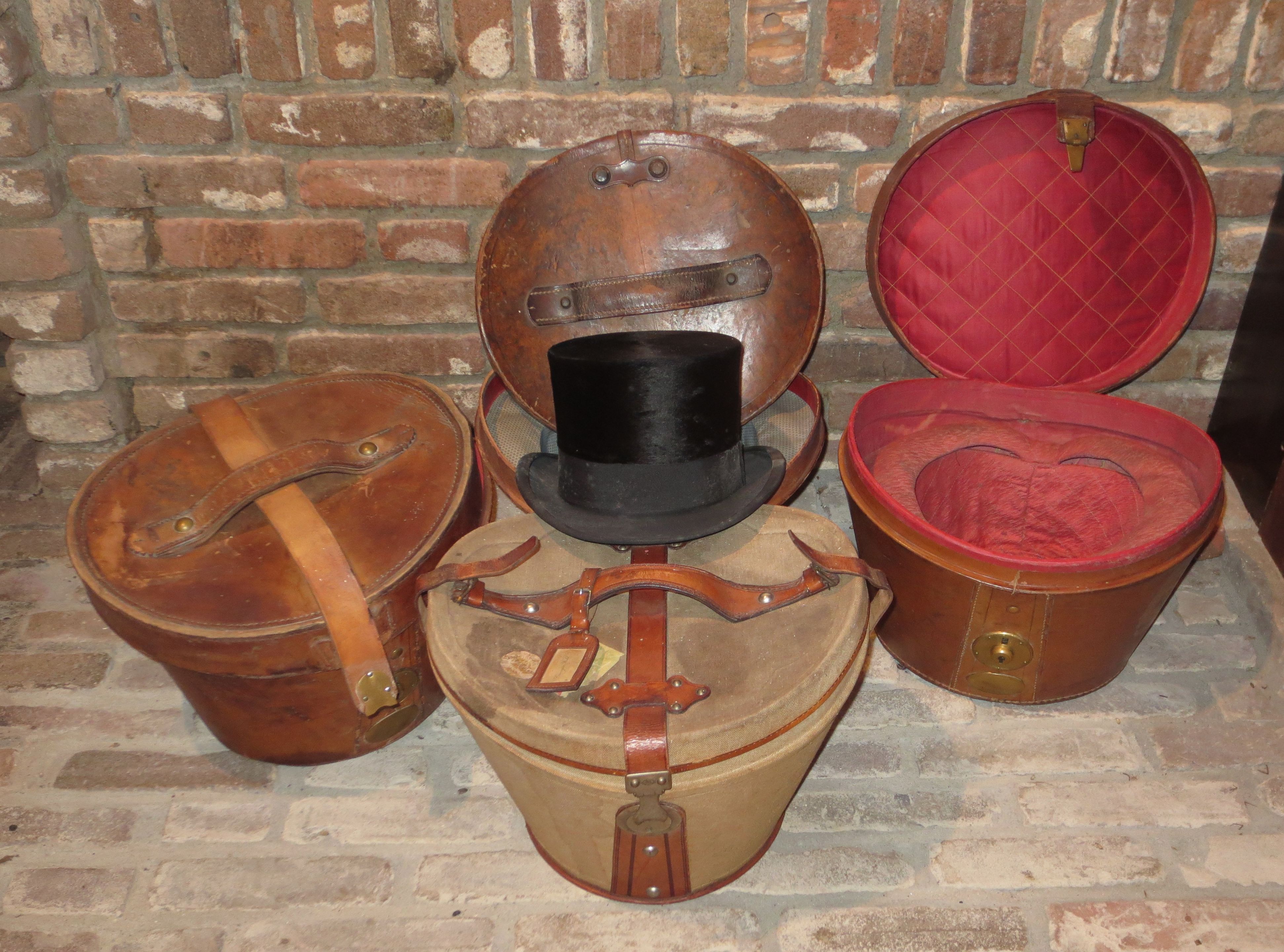 Bonhams Cars : Four assorted travelling top hat boxes, ((5))