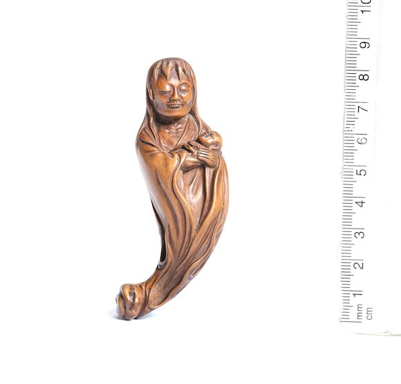 Bonhams : A boxwood netsuke of the ghost of an ubume 19th century