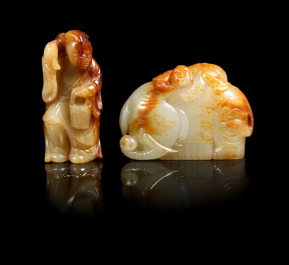 Bonhams : Two green and russet jades (2)