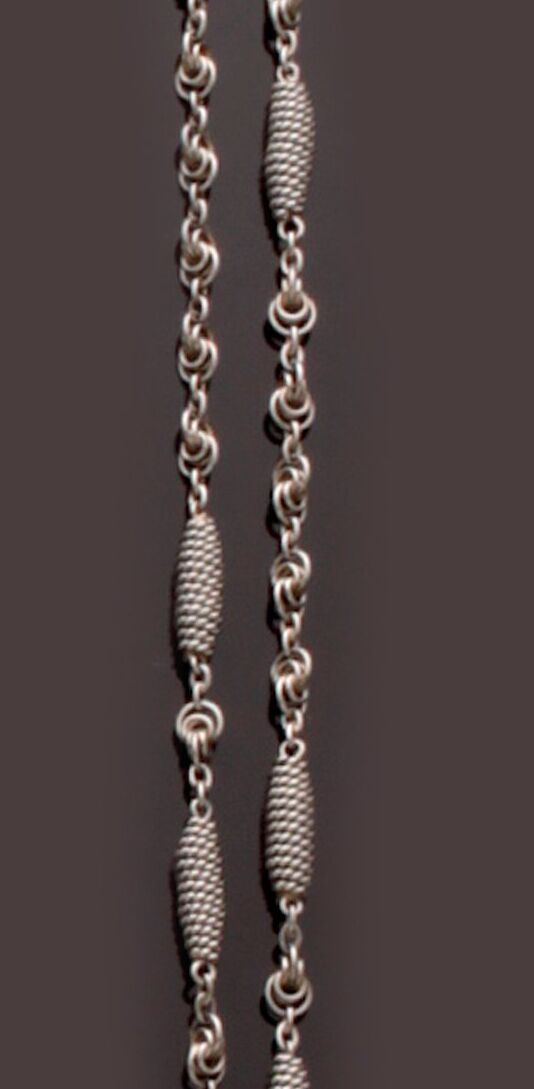 Bonhams : A white precious metal long chain