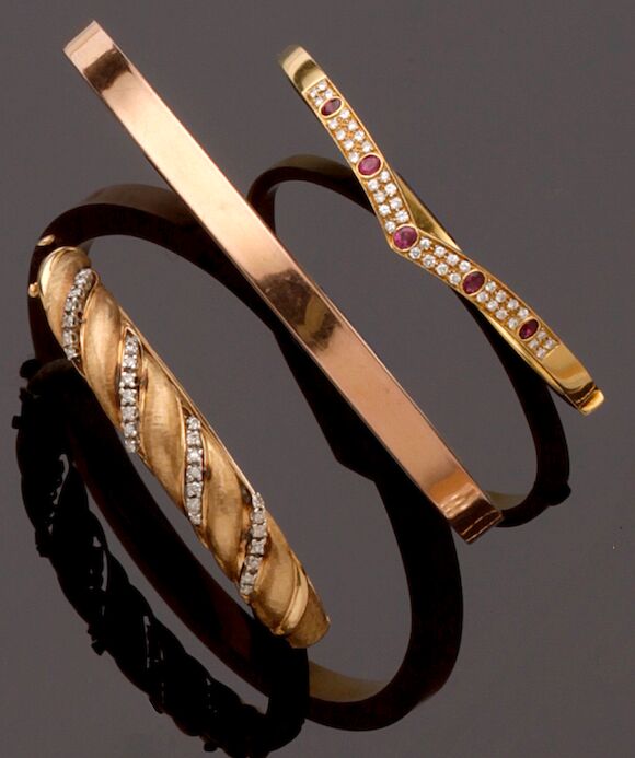 Bonhams : Two gem set bangles and a slave bangle (3)