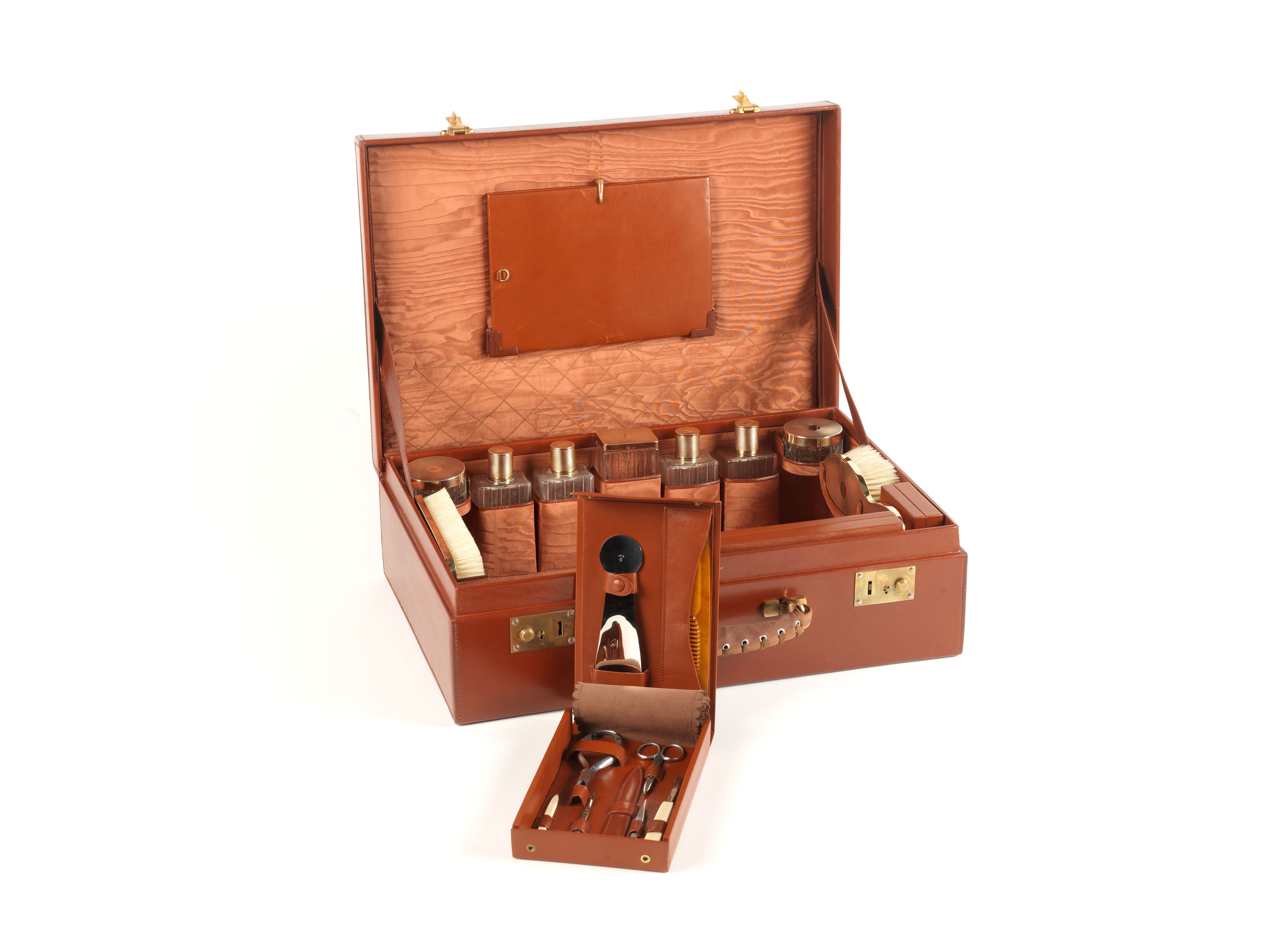 Bonhams Cars : A leather-cased vanity set by Cartier of Paris, circa 1940,