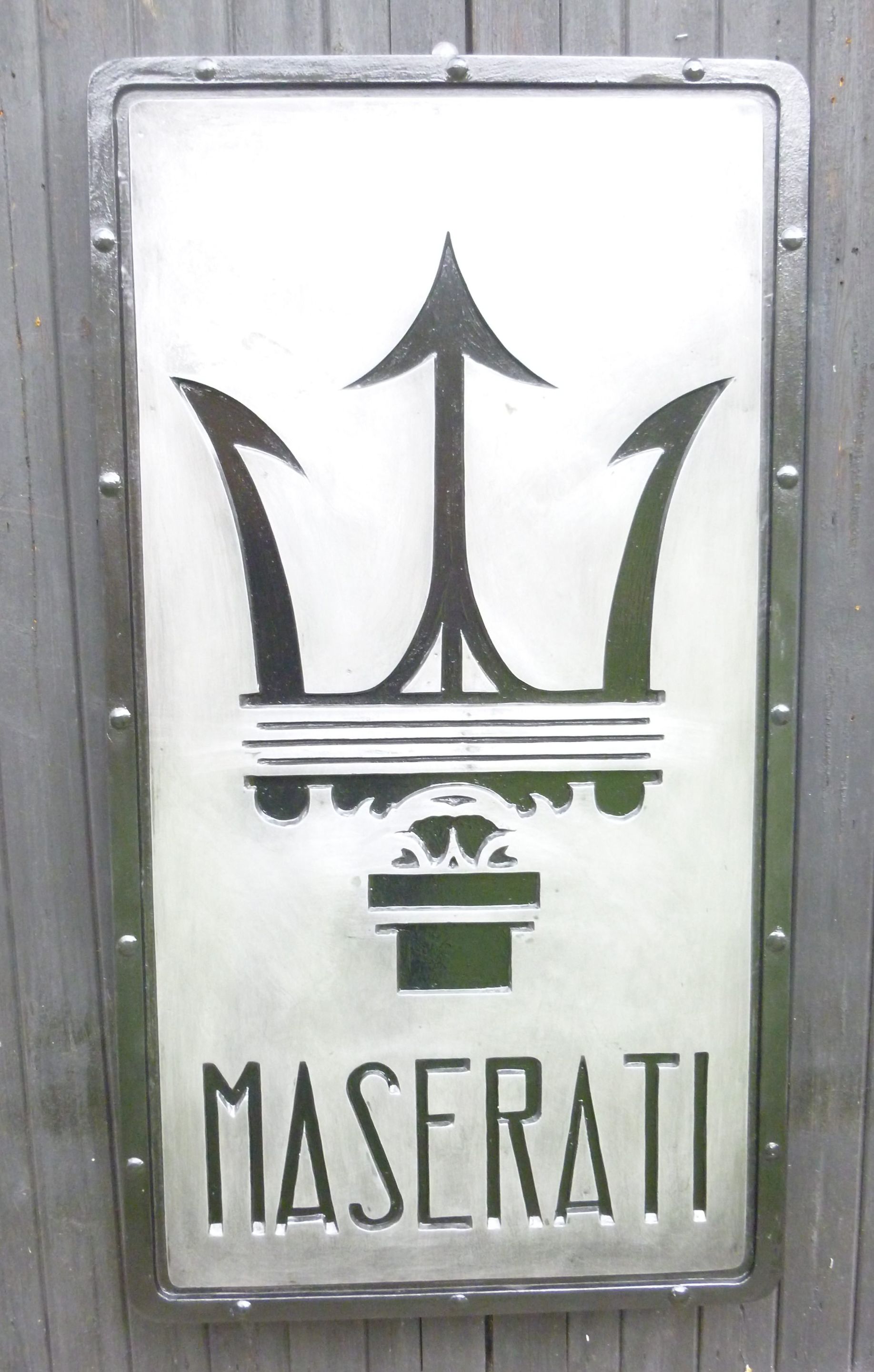Bonhams Cars : A 'Maserati' garage display emblem,