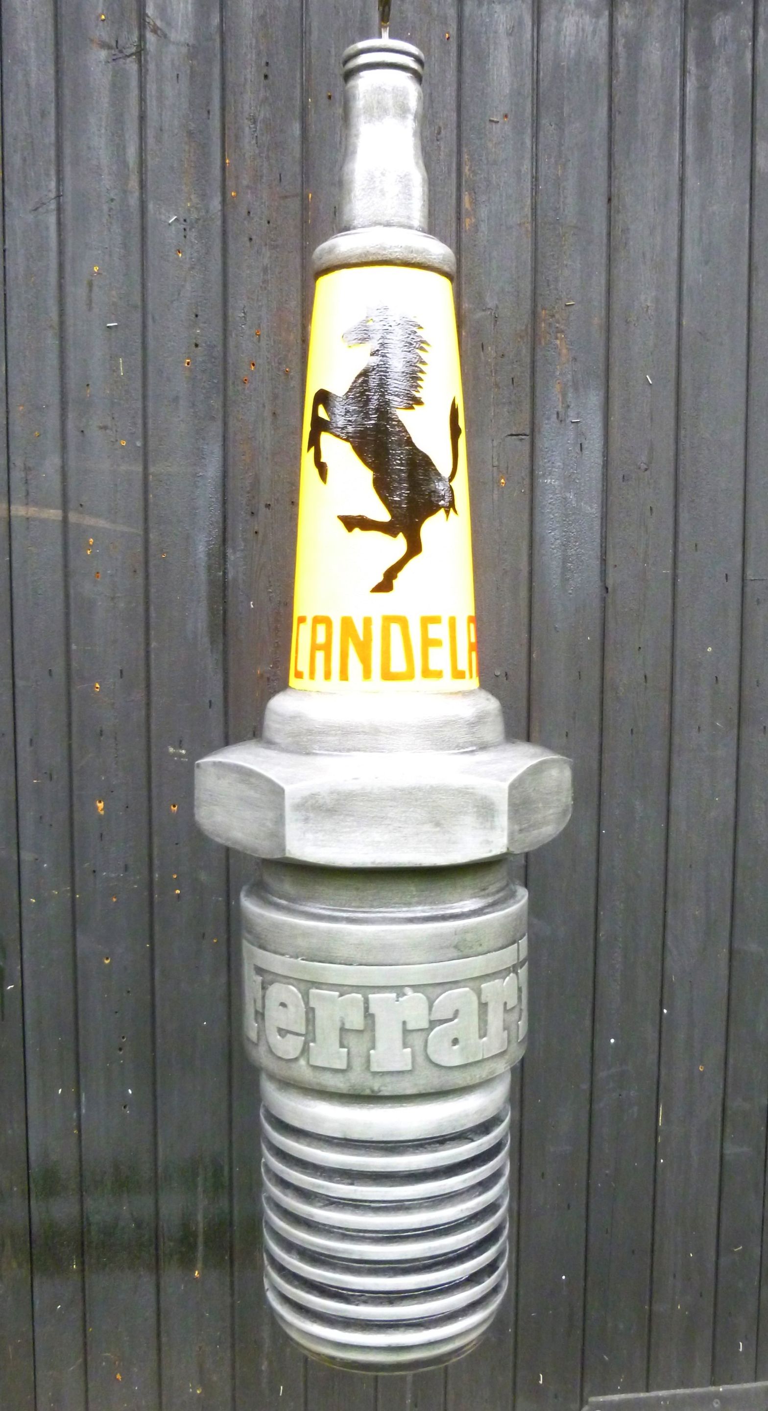 Bonhams Cars : A hand-painted 'Ferrari Spark Plug' for garage display,