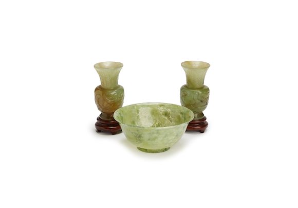 Bonhams : A small Chinese jade bowl, a pair of vases and a small bronze ...