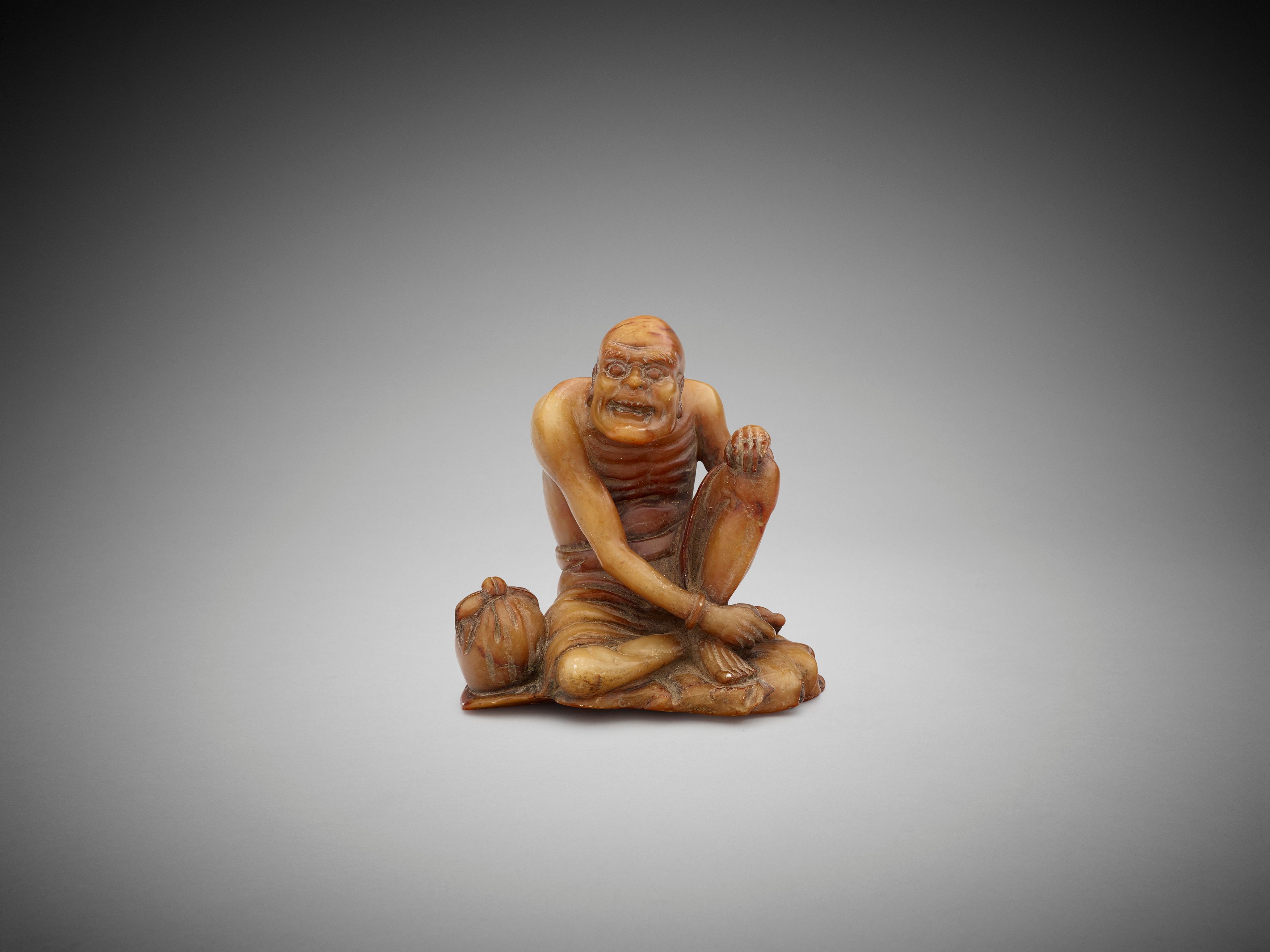 Bonhams : A Chinese soapstone carving of a lohan