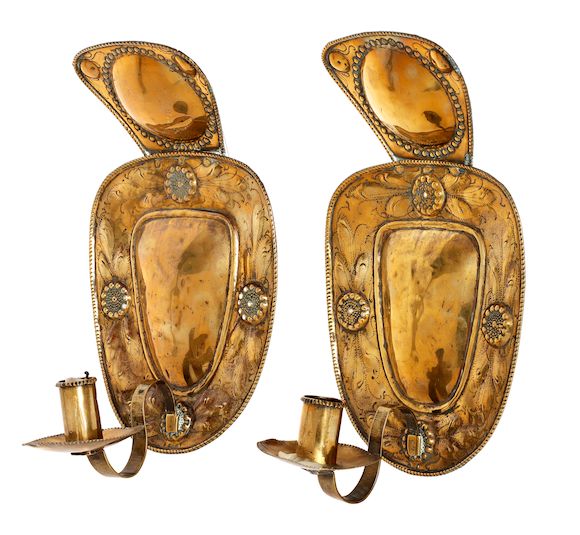 Bonhams : A small pair of late 17th/early 18th century sheet brass wall ...