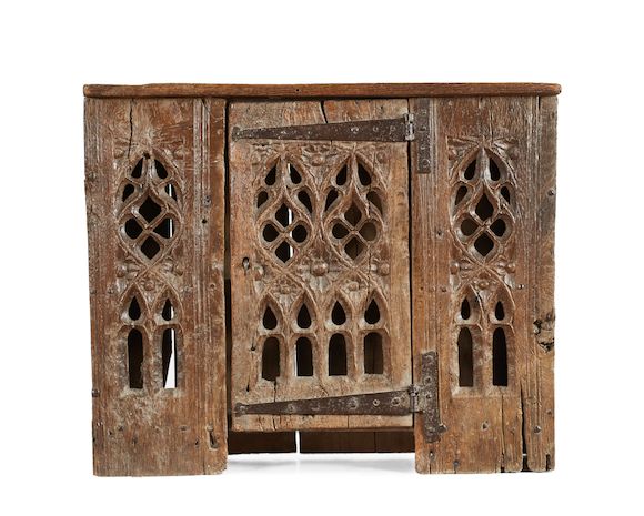 Bonhams : A small oak boarded aumbry In the mid-16th century manner