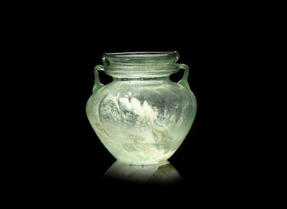 Bonhams : A Roman pale green glass handled jar