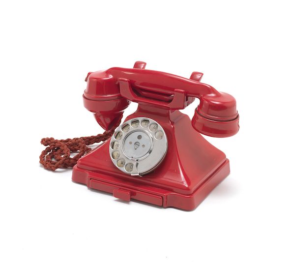 Bonhams : A 232CB red bakelite telephone,