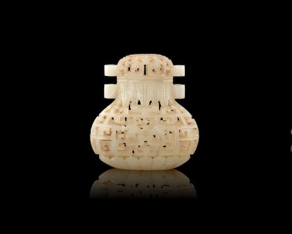 Bonhams : Two reticulated pale green jade vessels (4)