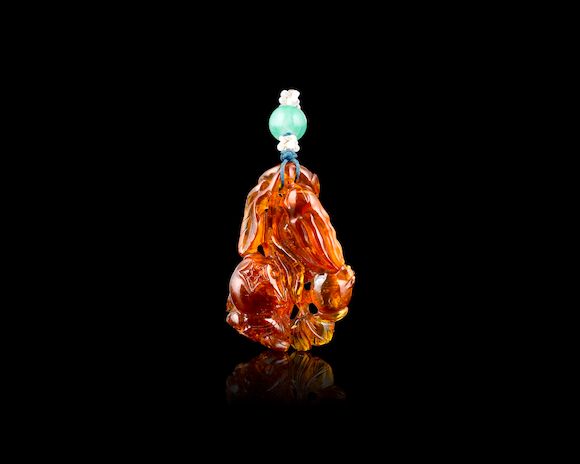 Bonhams : An amber 'Three Abundances' pendant 18th/19th century